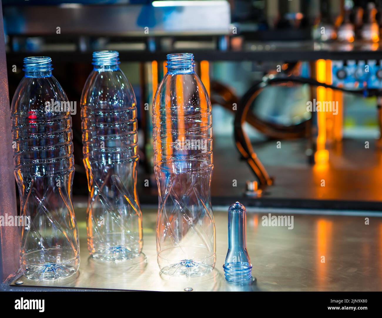 Plastic bottles and raw material for plastic bottle manufacturing process on plastic bottle ...