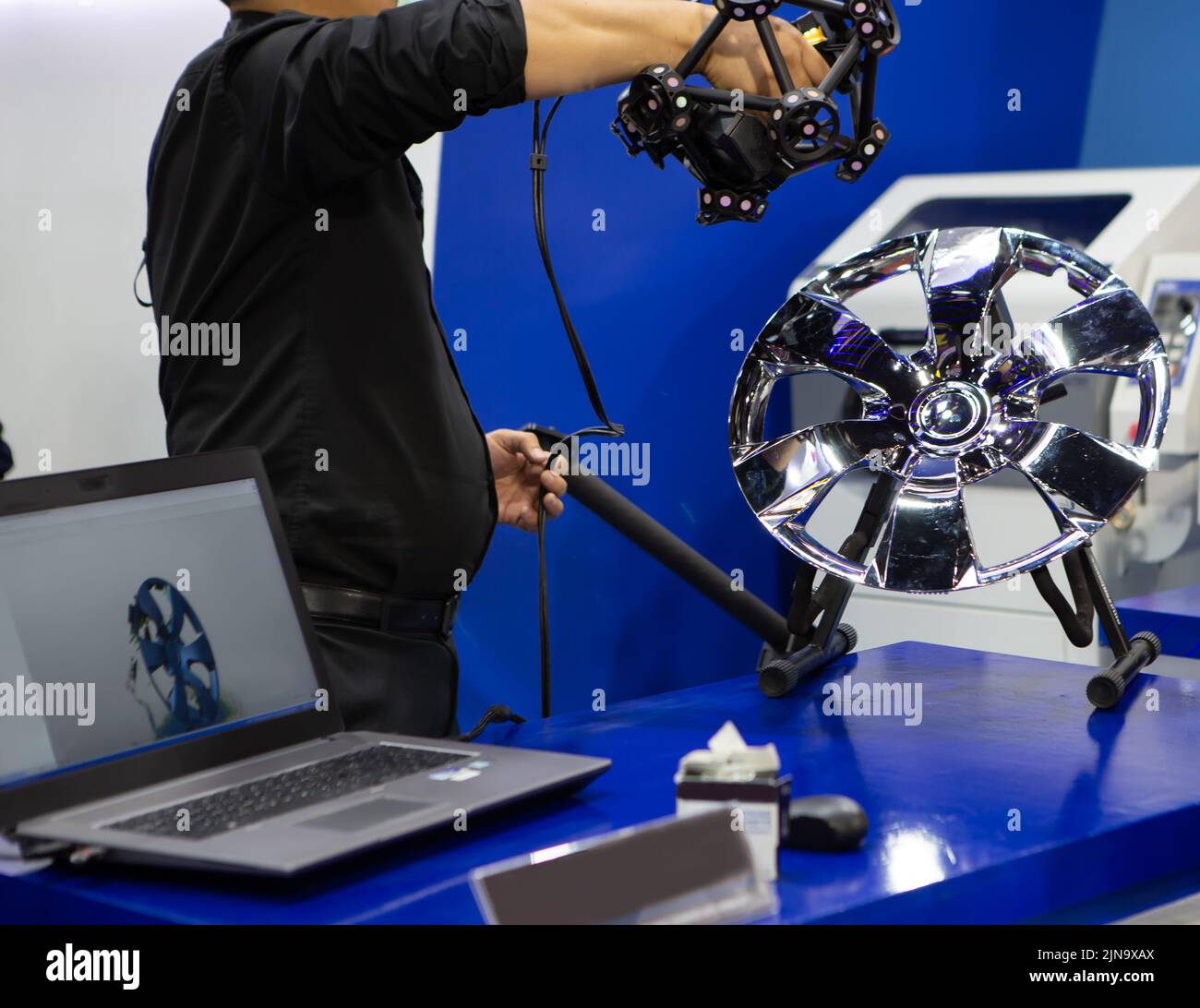 Industrial technician use handheld 3D scanner or portable CMM ...