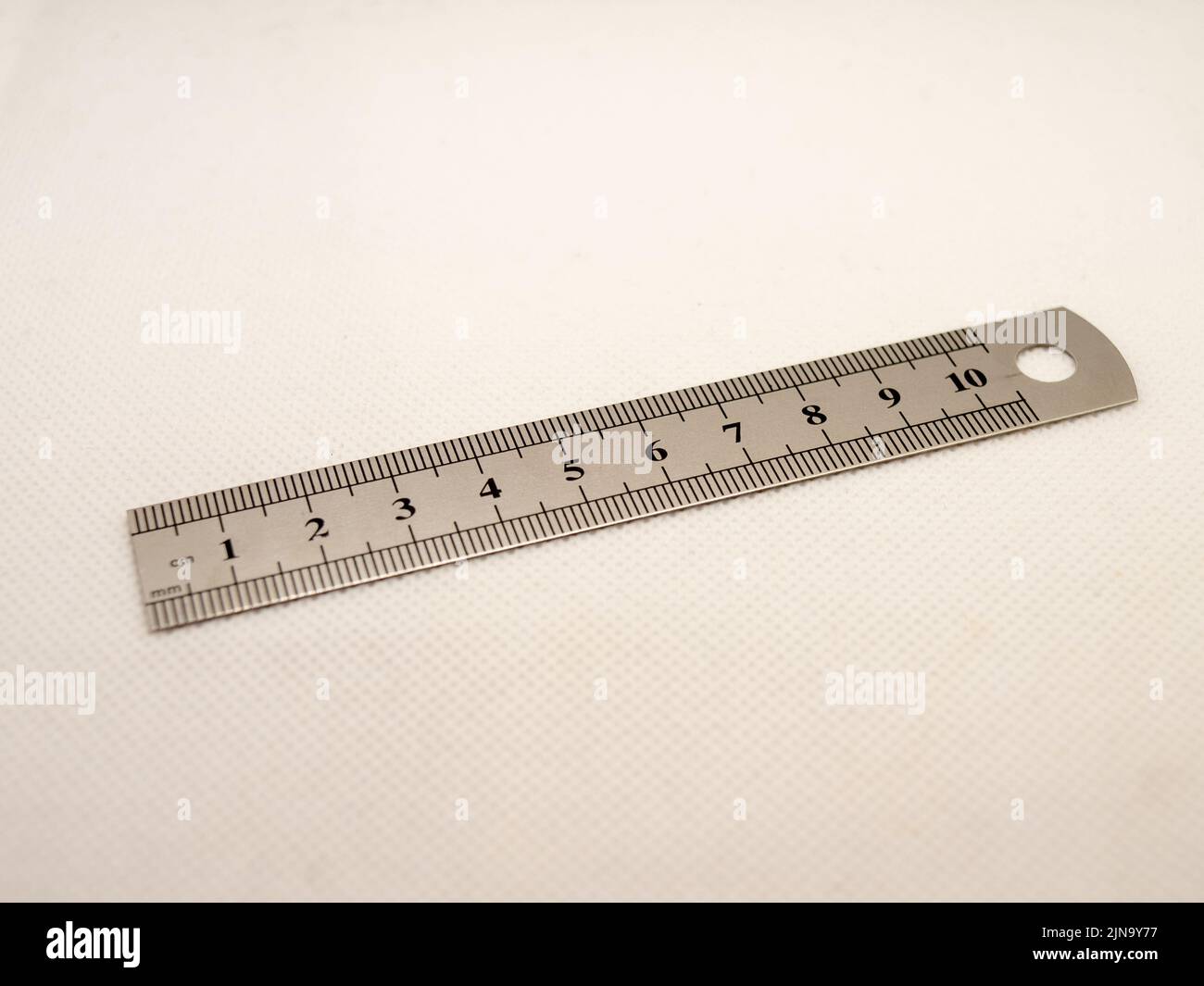 A short metal ruler (10cm Stock Photo - Alamy
