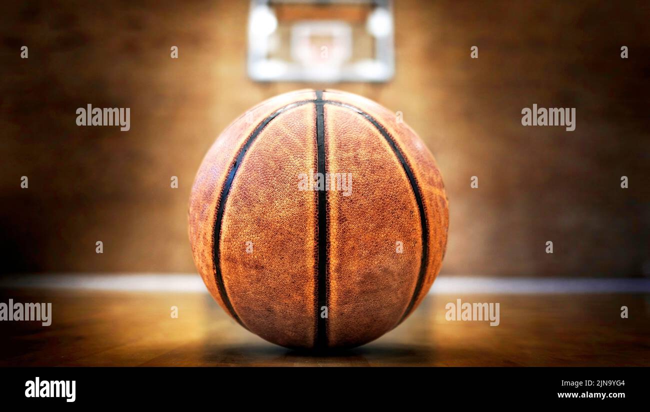 Basketball court with ball hoops rims hardwood floor and lights for ...