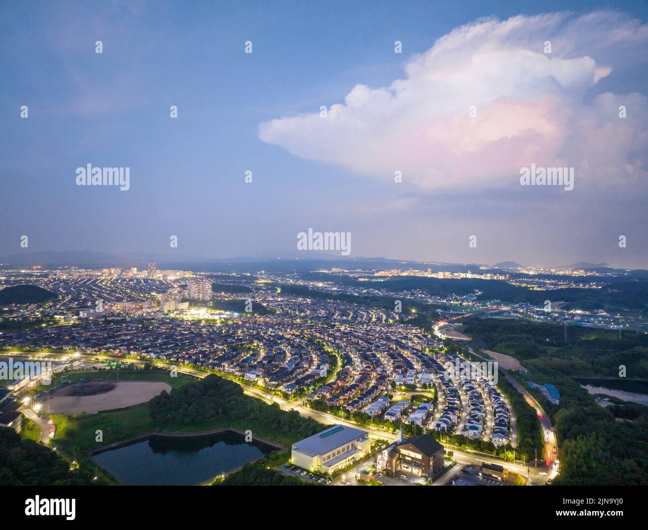 Aerial view of baseball field and lights from suburban community at ...