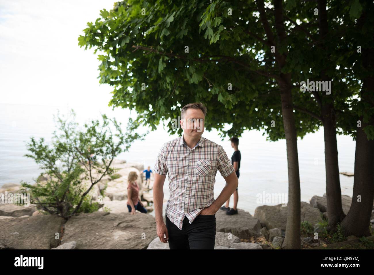 Myron Genyk poses for a photograph while out on the lakeshore with his ...