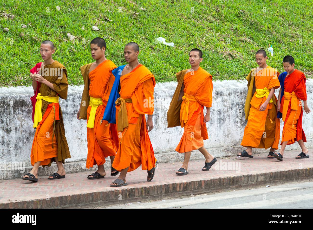 Novice monks walking hi-res stock photography and images - Alamy