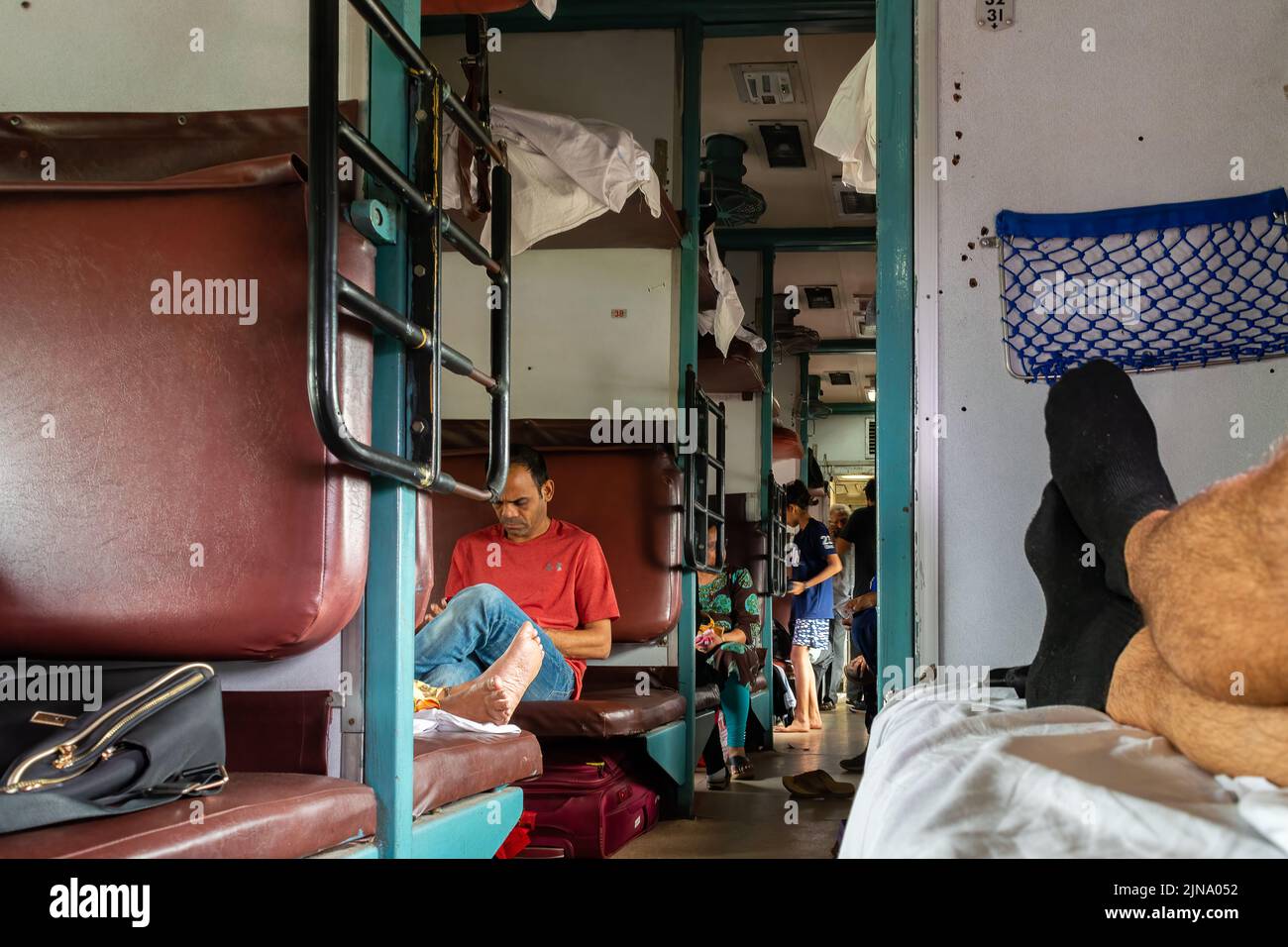 A sleeper class train wagon full of people going to Mumbai, India Stock ...