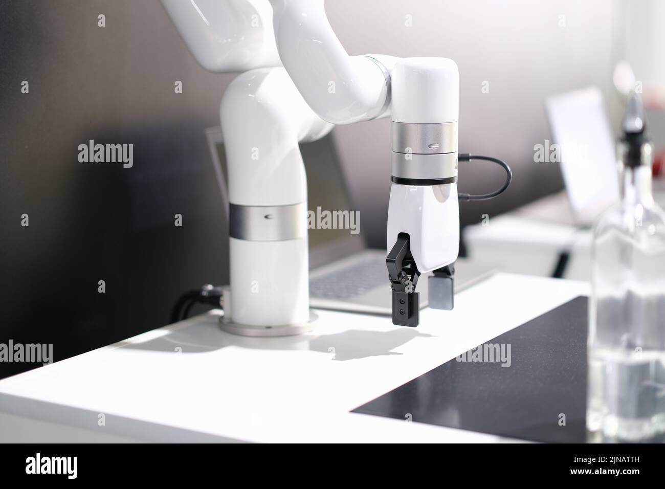 Rendering of robotic arm working in factory Stock Photo - Alamy
