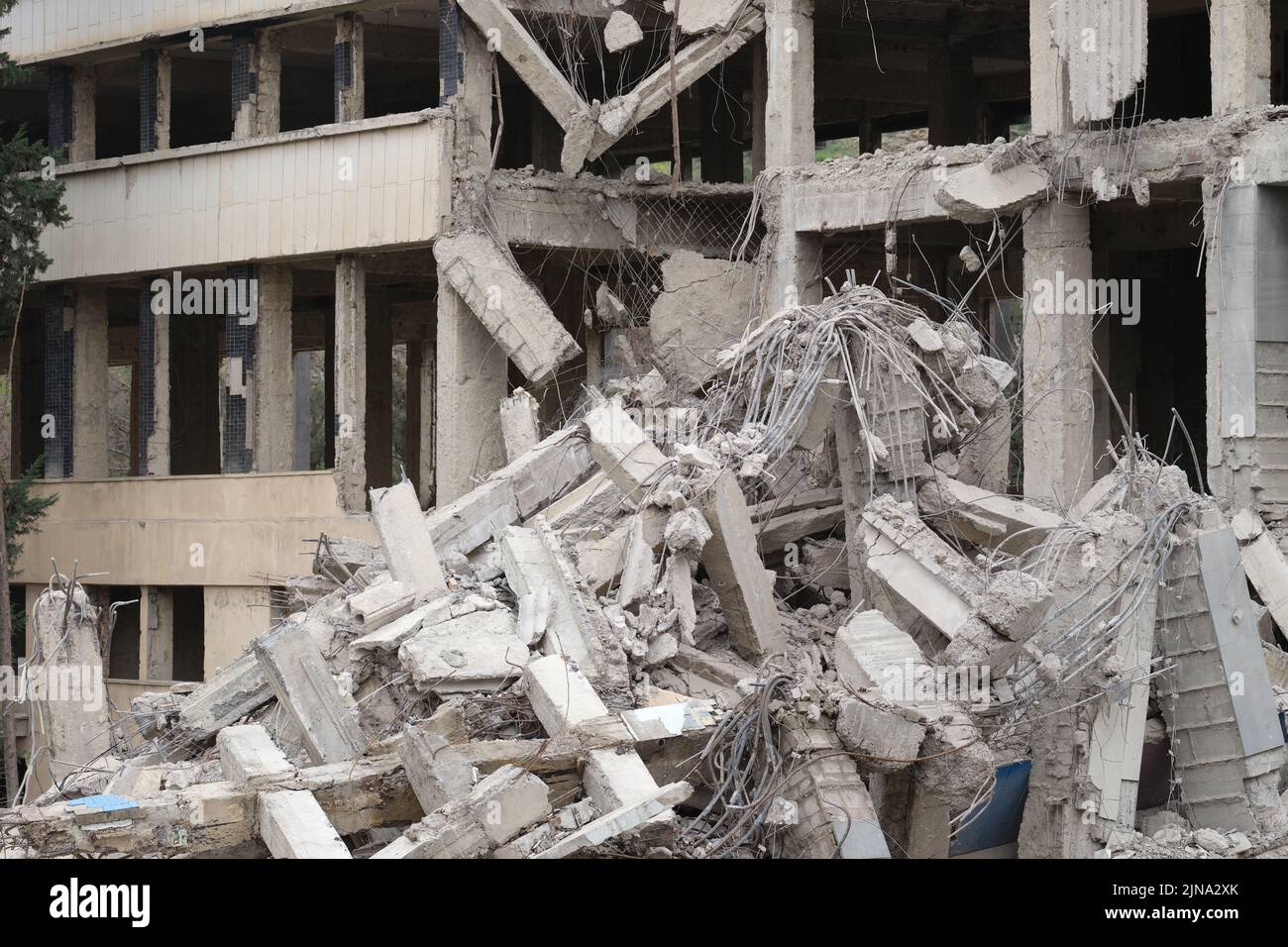 Destroyed cement building warrior rocket strike or earthquake Stock ...