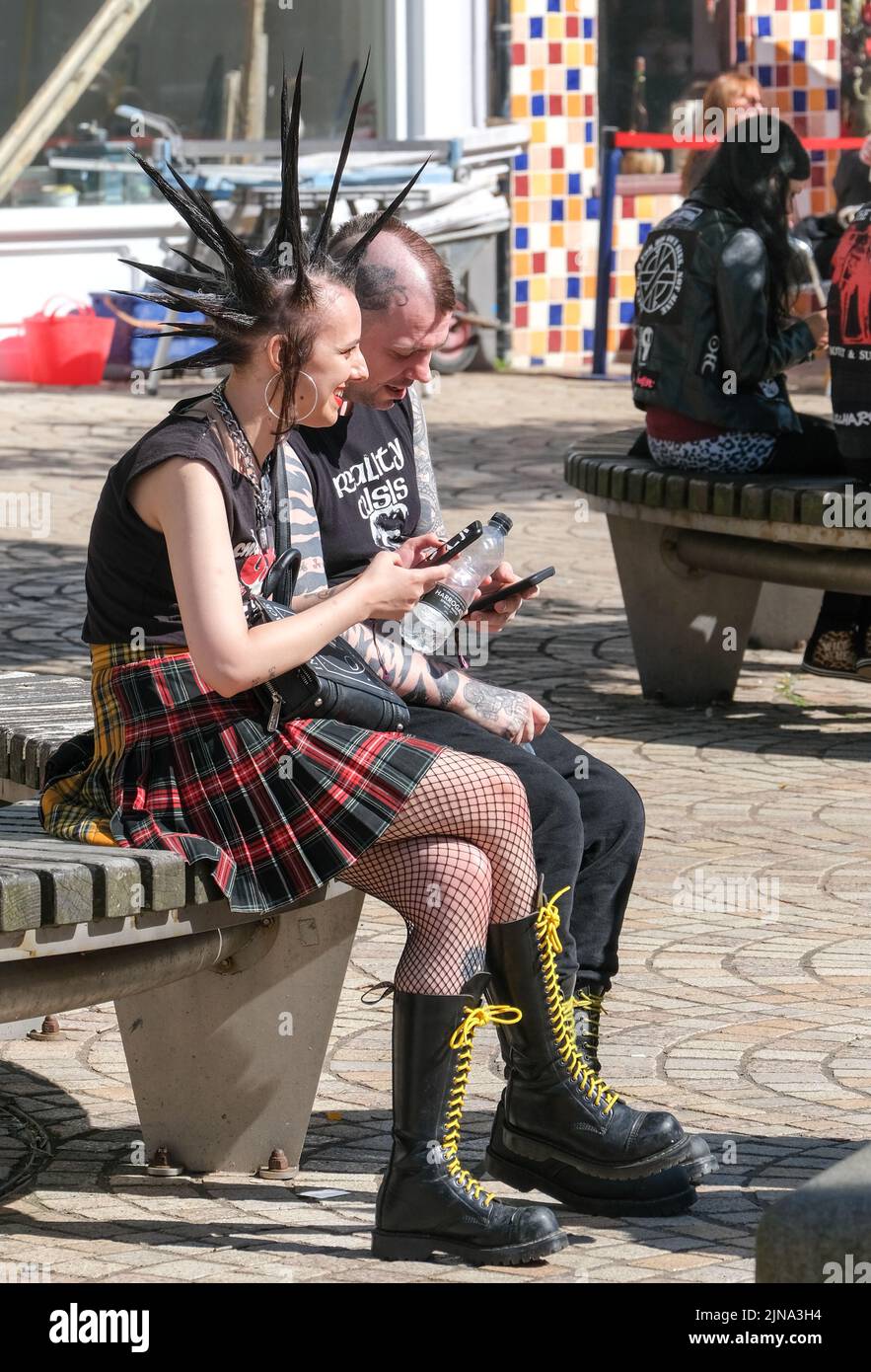 Blackpool, Lancashire, UK August 6 2022 A young couple sitting during ...