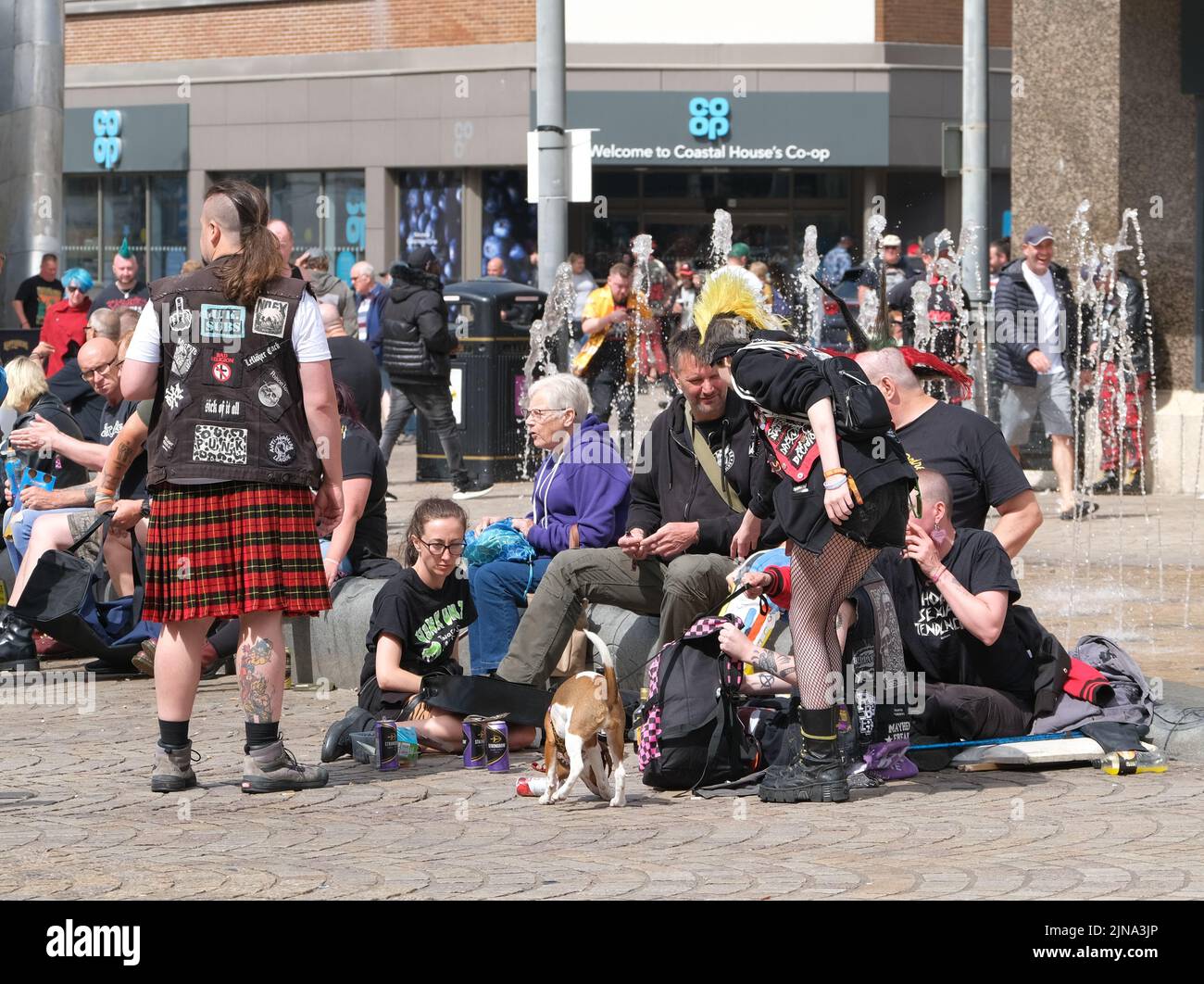 Blackpool, Lancashire, UK August 6 2022 A group of punks and dog gather ...
