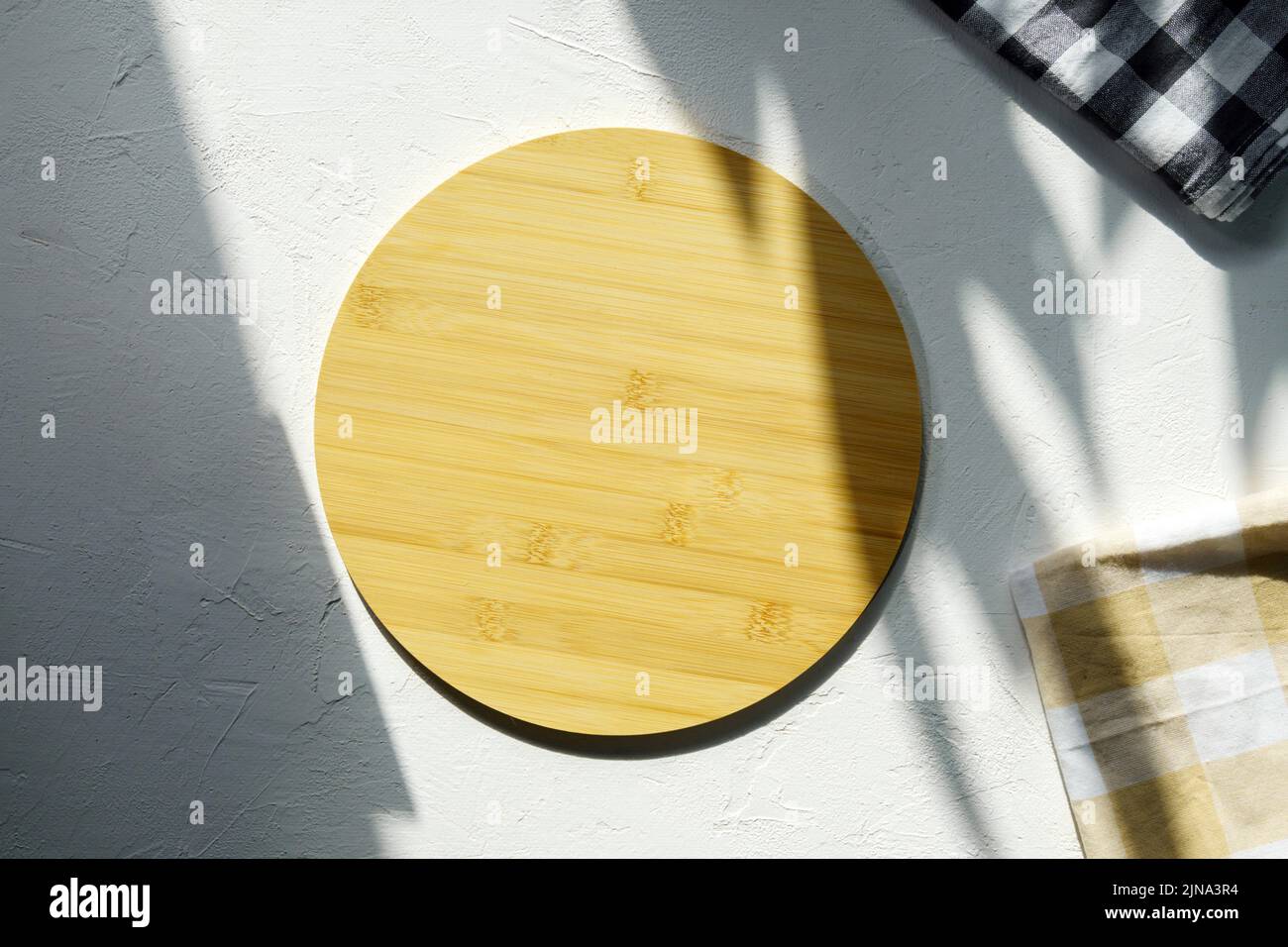 Cutting board on a light concrete background. Cooking backdrop. Top ...
