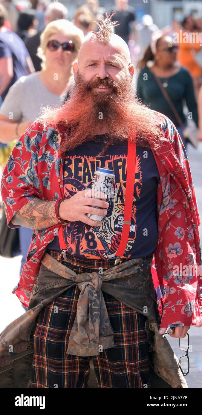 Blackpool, Lancashire, UK August 6 2022 A punk with vivid orange beard ...
