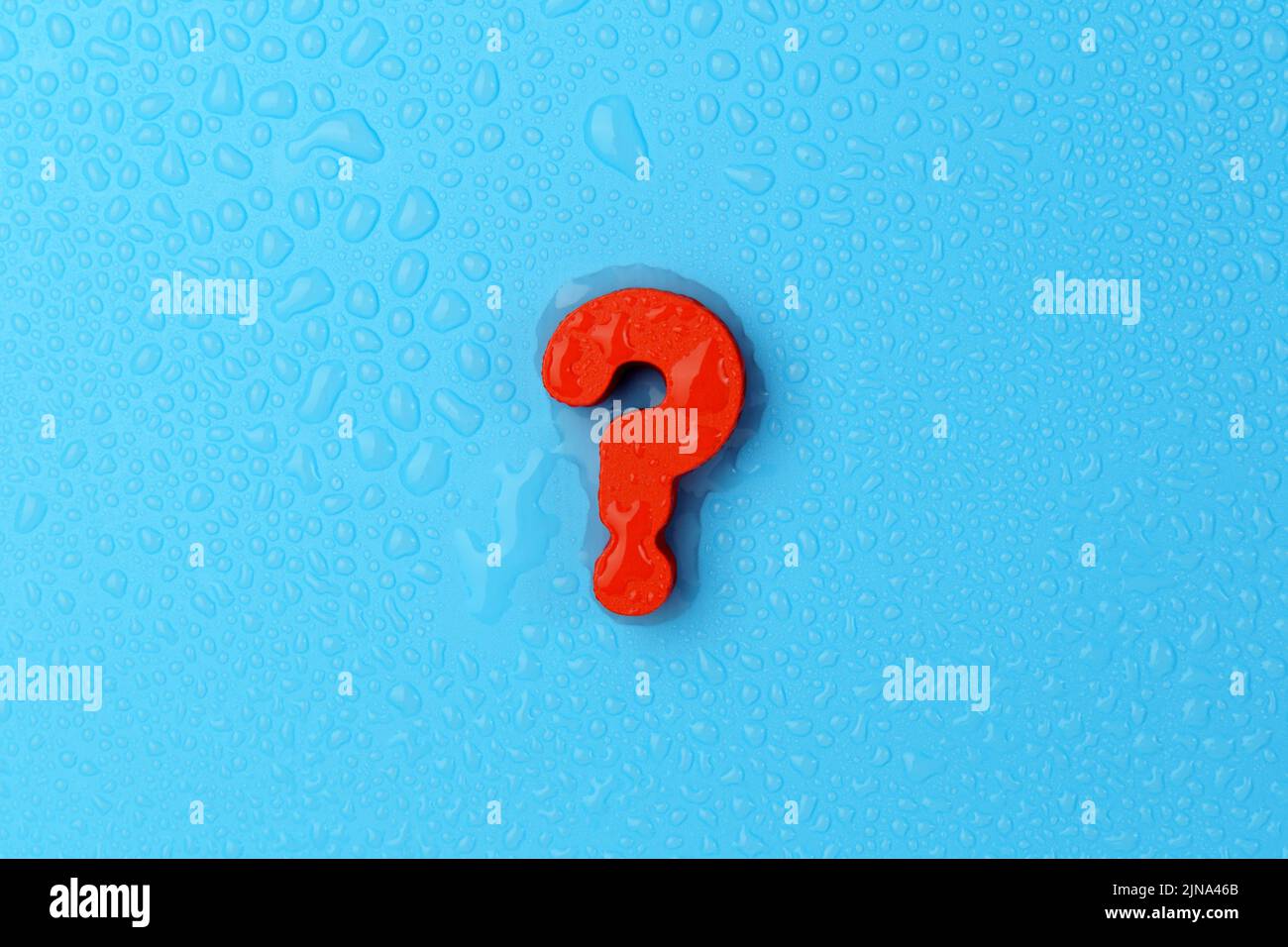Red question mark on a blue background. The concept of the problem and ...