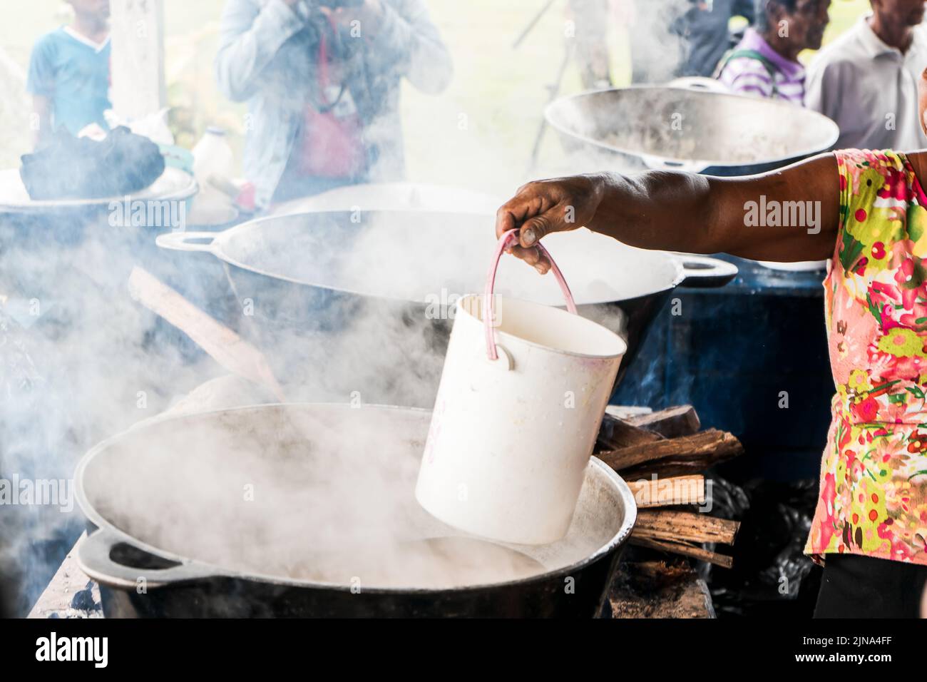 Distributing beef soup known as Luk Luk, a typical dish of the ...