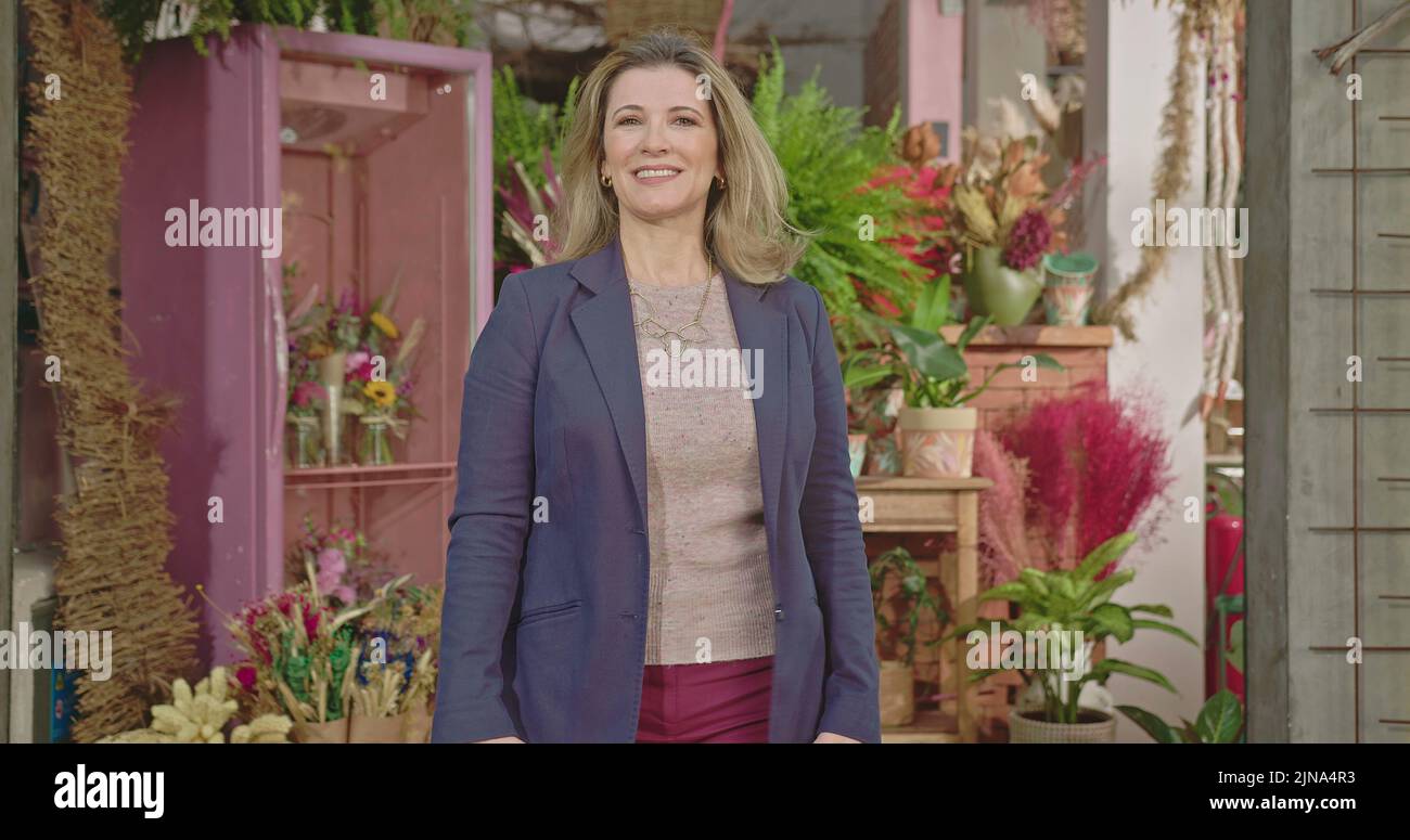 Portrait of a businesswoman owner of local shop with arms crossed ...