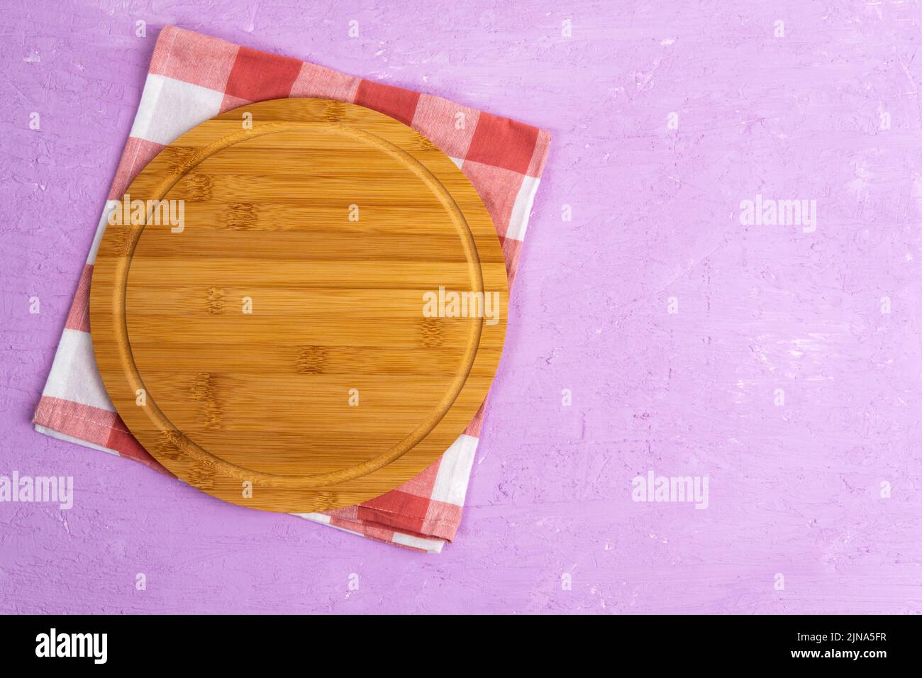 Empty wooden plate on concrete table. Wood plate for food. Flat lay ...