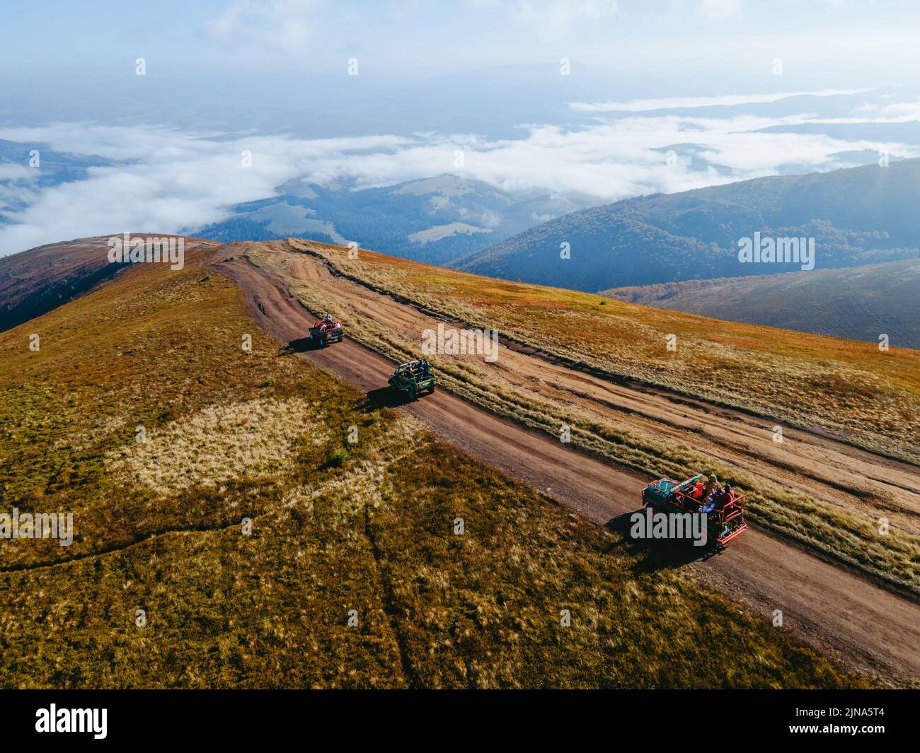 aerial view of suv off road travel climbing up by mountain hill Stock ...