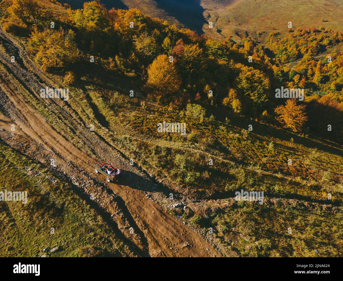 aerial view of suv off road travel climbing up by mountain hill Stock ...