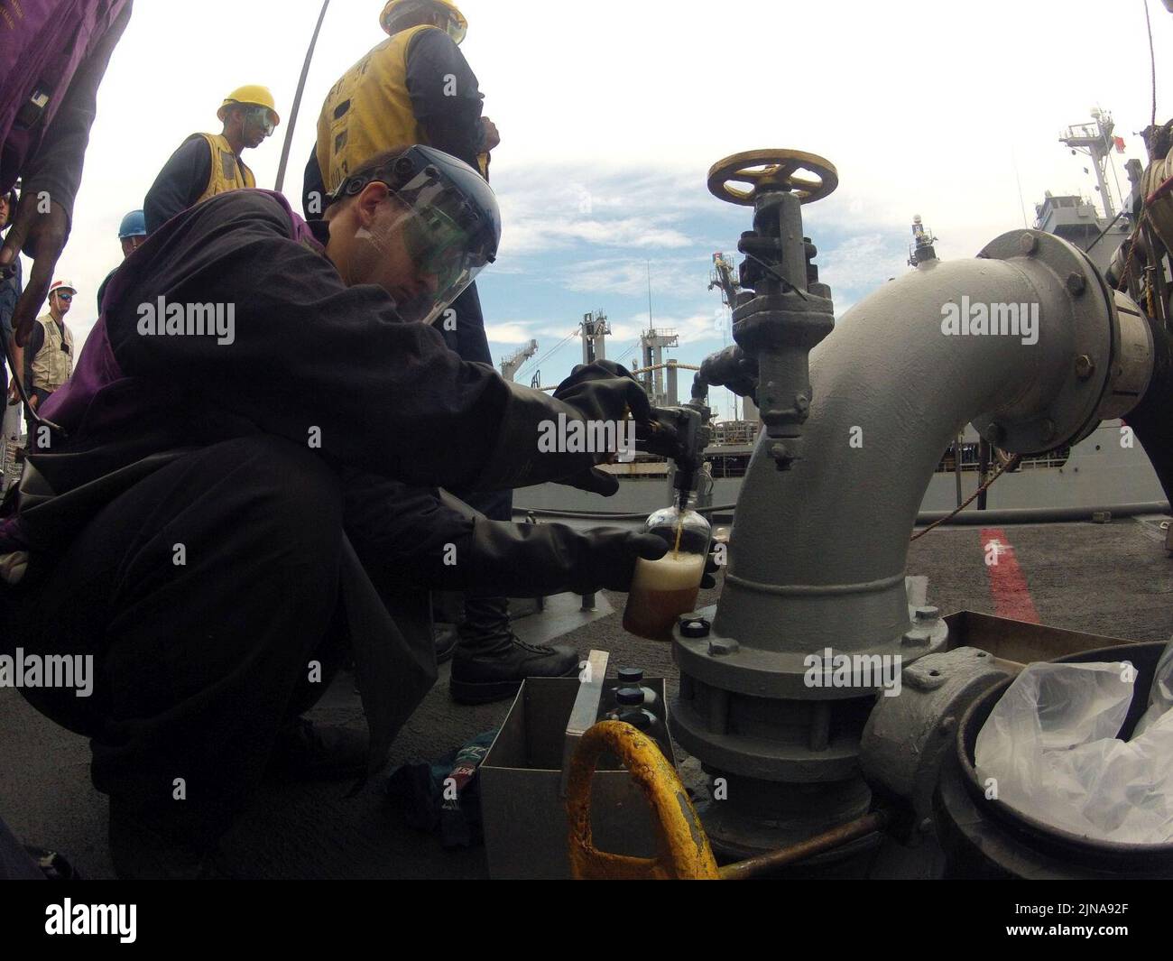 Taking a fuel sample 121020 Stock Photo - Alamy