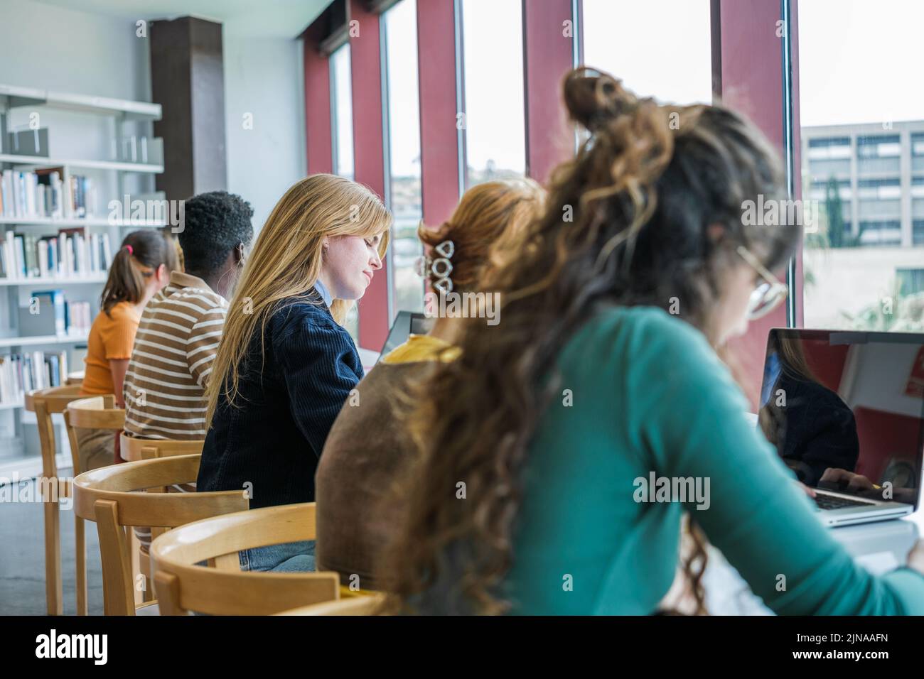 Group of students from different cultures studying in the university ...