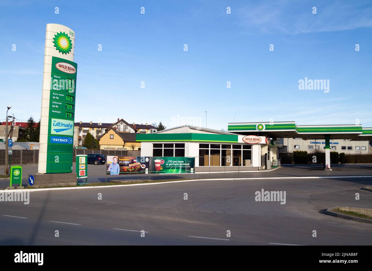 BP and Wild Bean Cafe sign outside a petrol station. British Petroleum ...