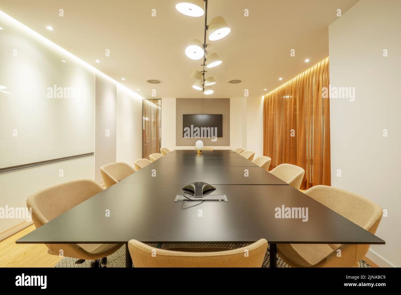 Boardroom with long black table of a professional office with flat ...