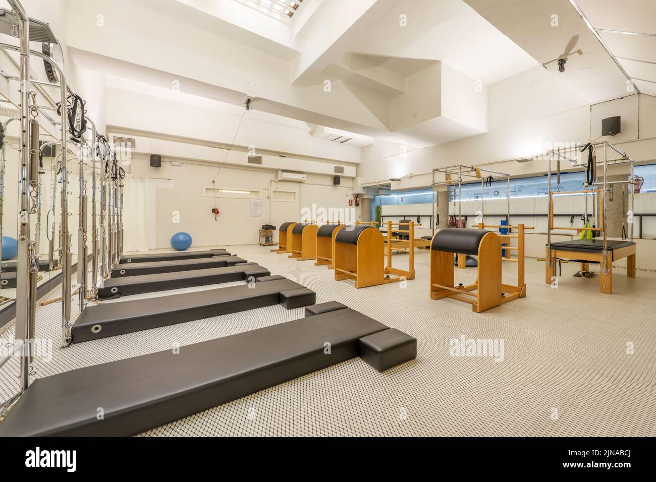 Gym room with various wooden and stainless steel equipment Stock Photo ...