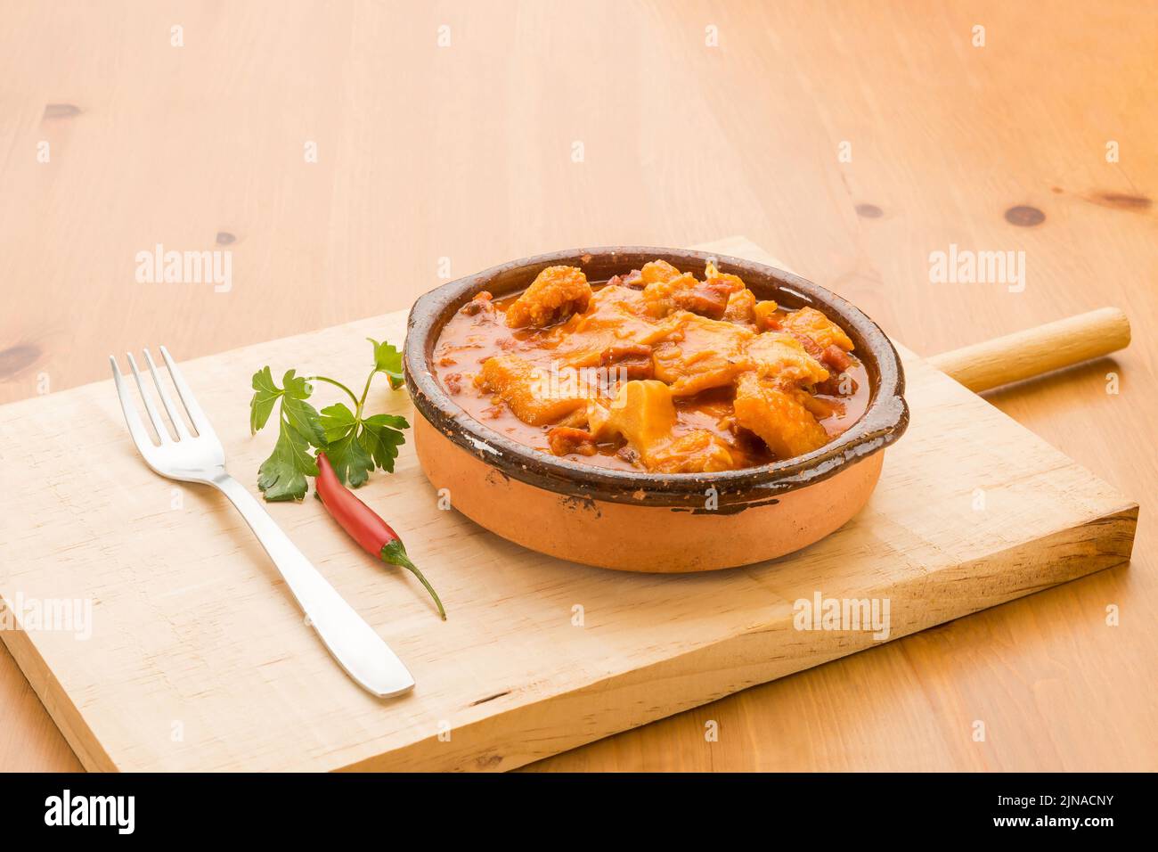 Callos a la madrilena stewed in a clay pot, typical Spanish food Stock ...