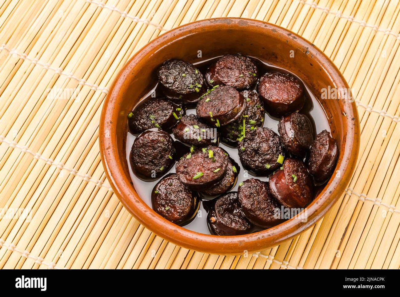 Chorizo in wine, tapas and typical Spanish food in a clay pot Stock ...