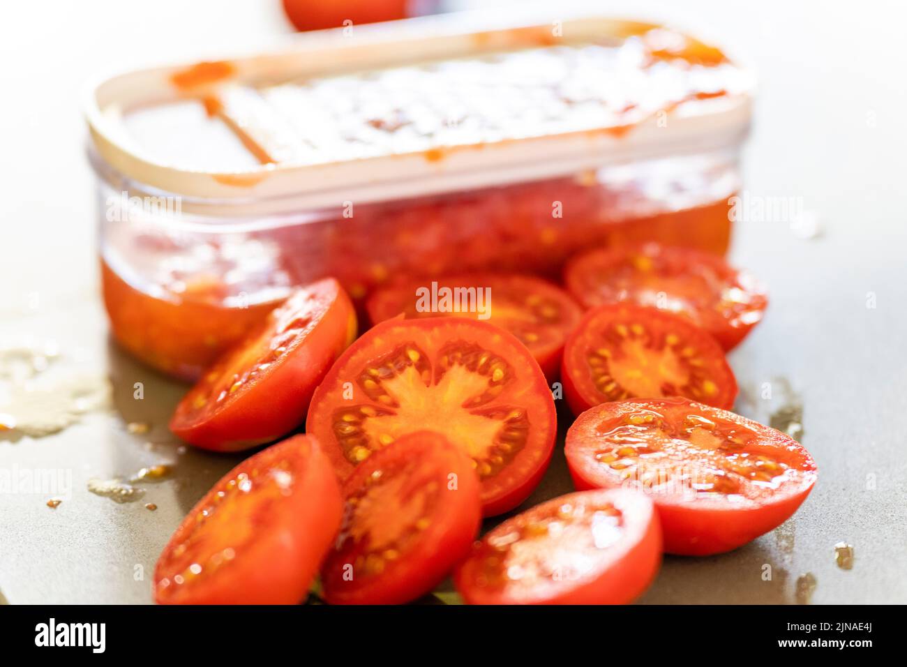 grating tomatoes for sauce, mallorca, spain Stock Photo - Alamy