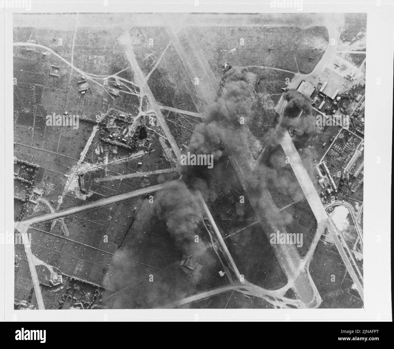Tan Son Nhut airfield, Saigon, Indochina, under attack by U.S. Navy ...