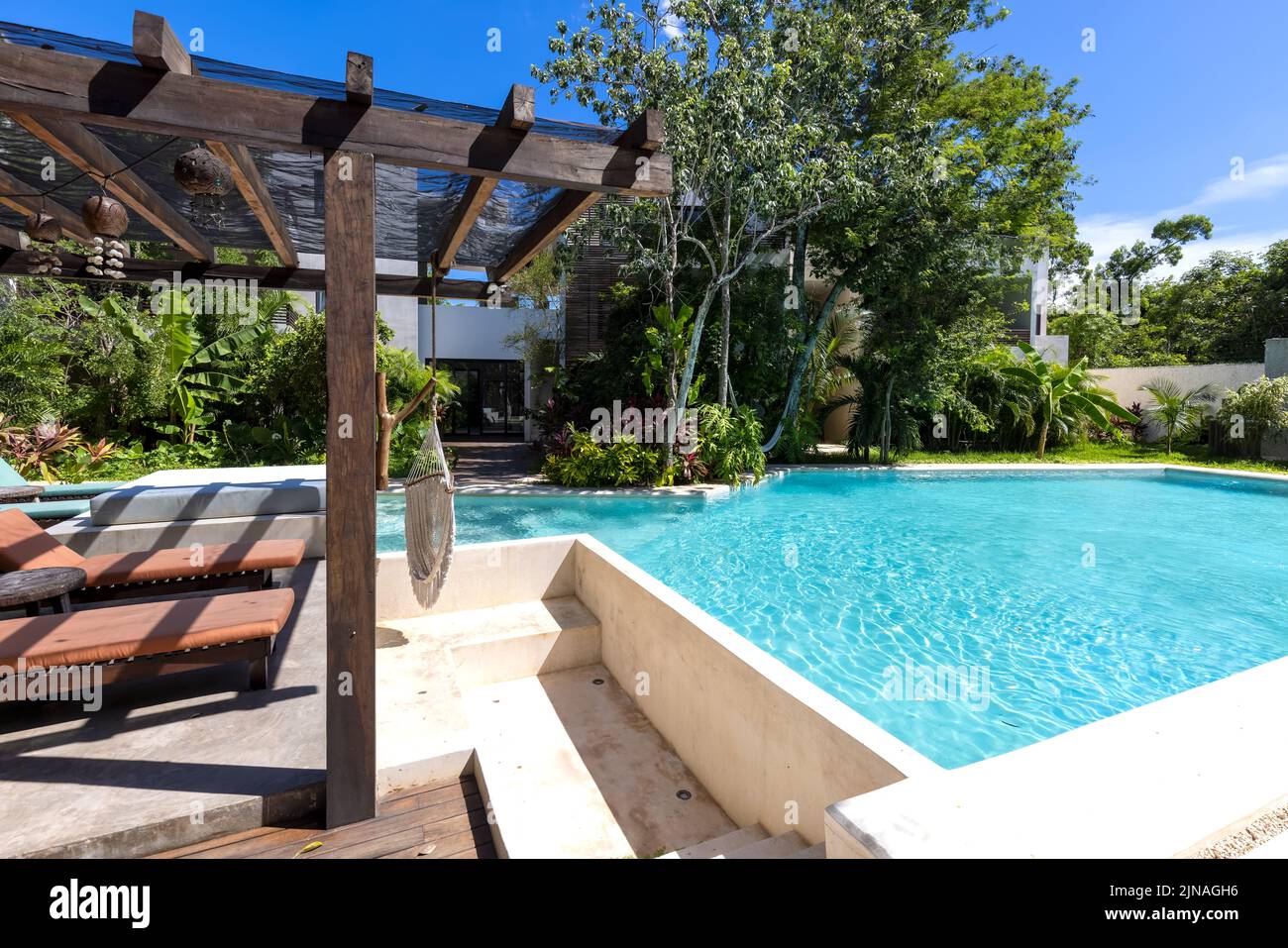 Mexico, Tulum upscale hotel patio with jungle views and hammock Stock ...
