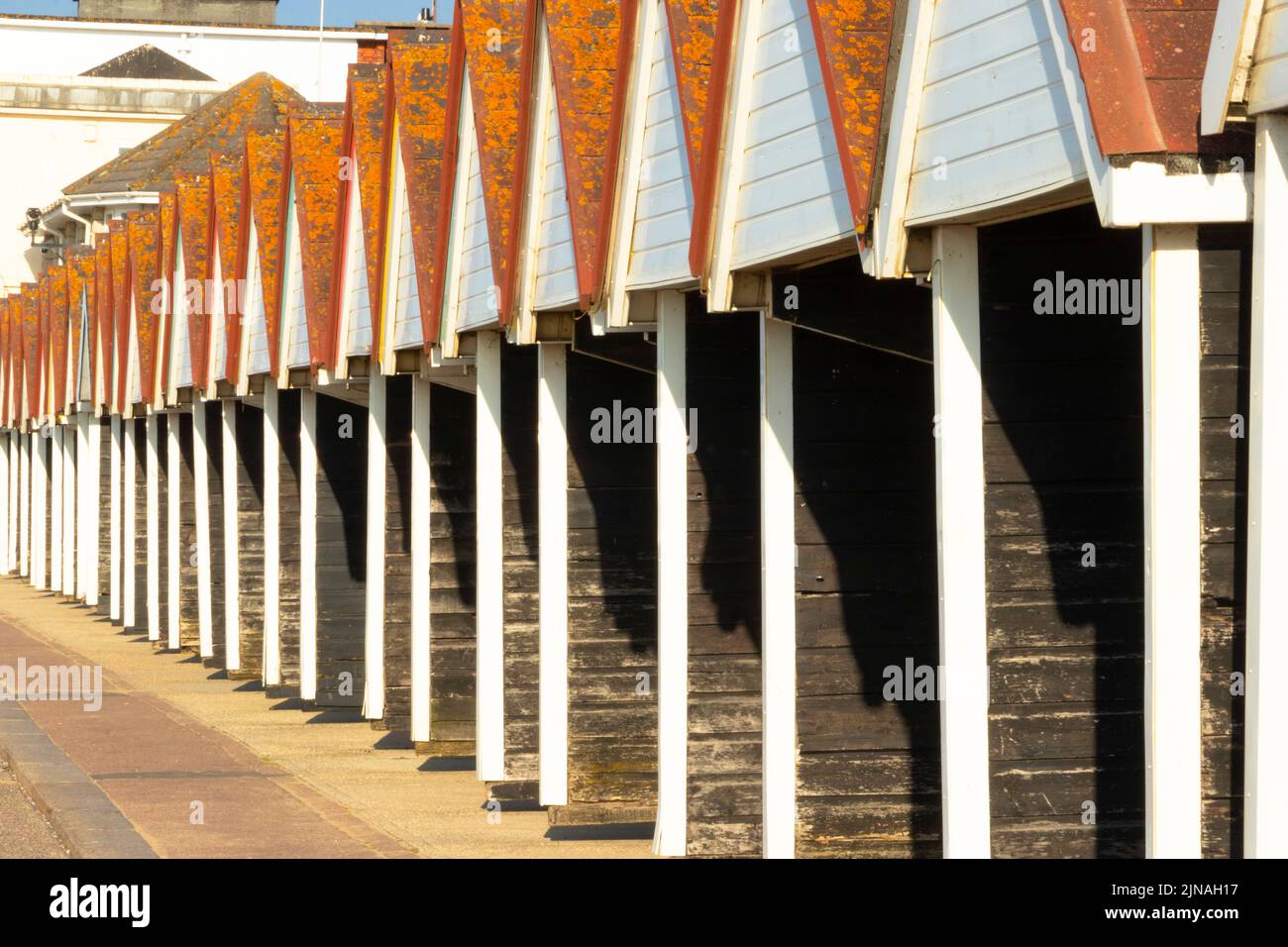 row of wooden beach huts by sea Bournemouth Dorset Uk Oldest municipal ...