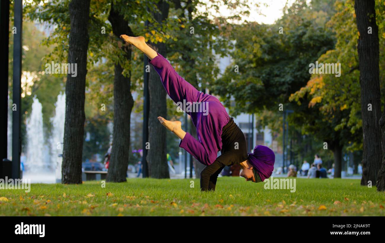 Strong active muslim girl in hijab woman yogi sportswoman doing yoga ...