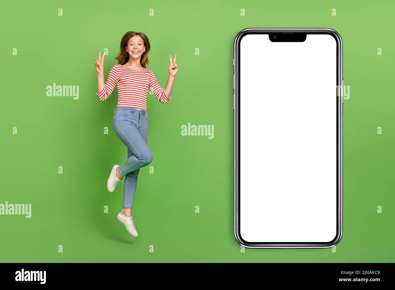 Photo of cheerful friendly lady jump show v-signs wear striped shirt ...