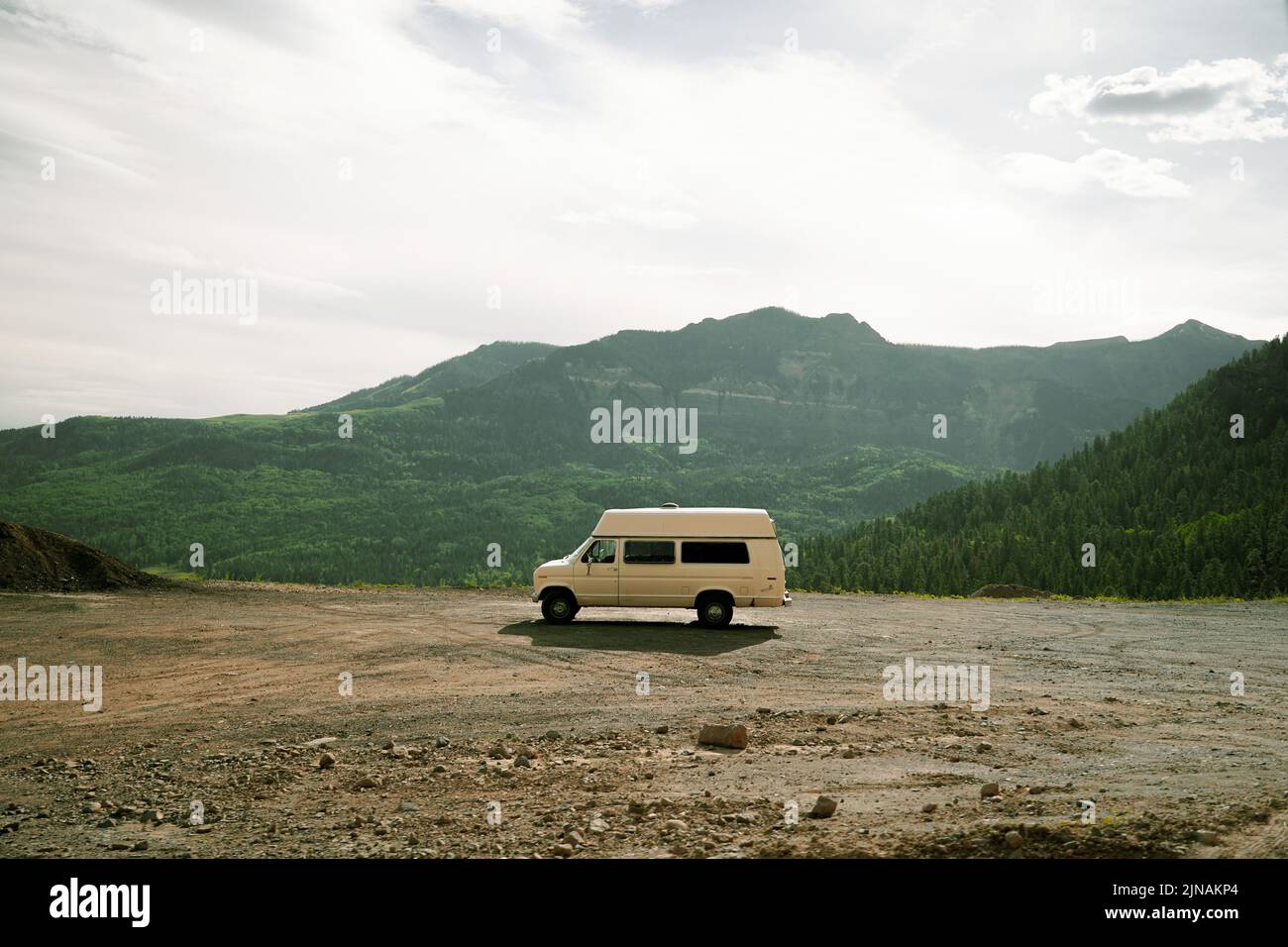 A view of a lonely car on the background of mountains and hills Stock ...