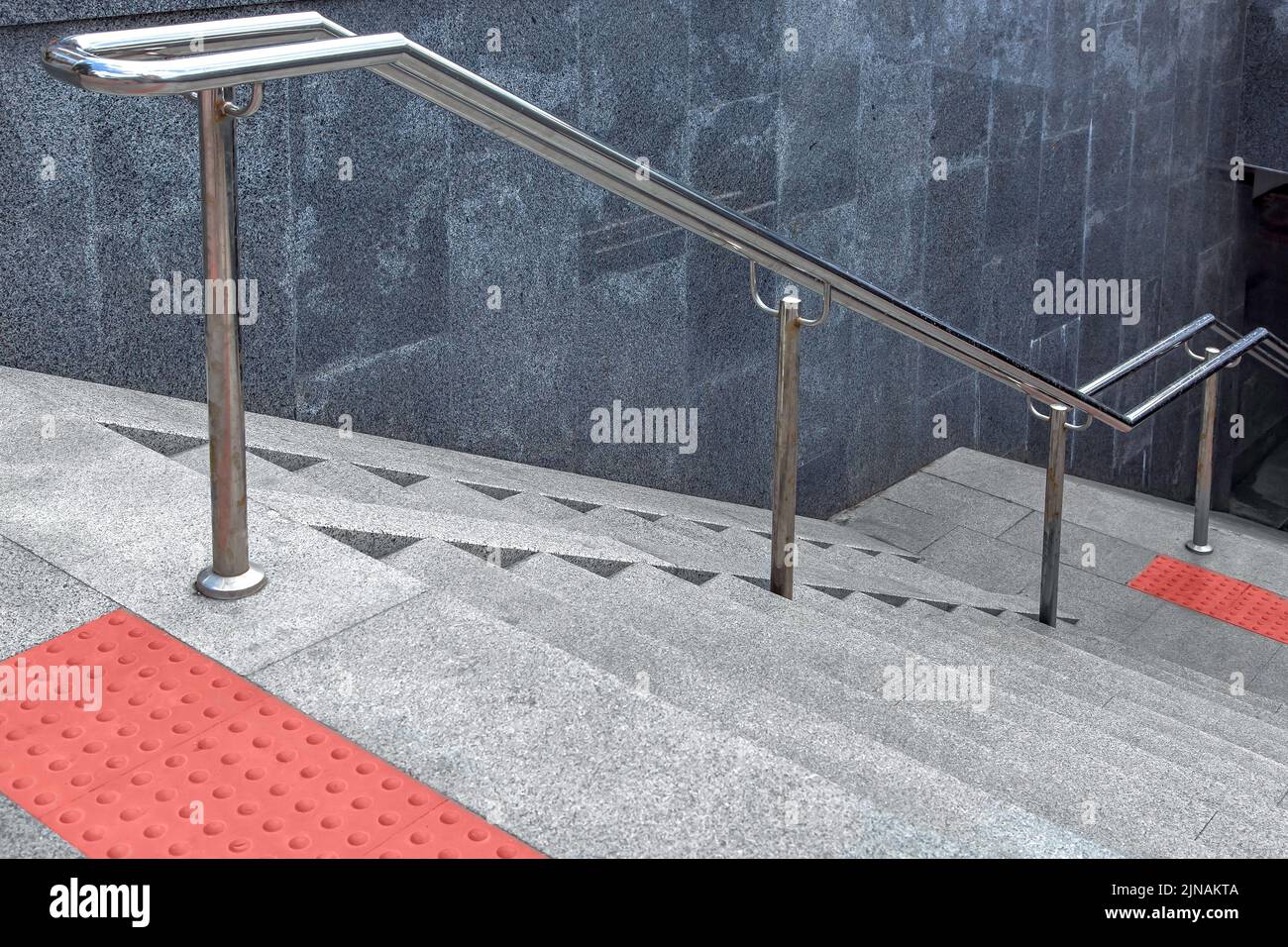 stainless steel iron handrail descent to underground crossing with ...