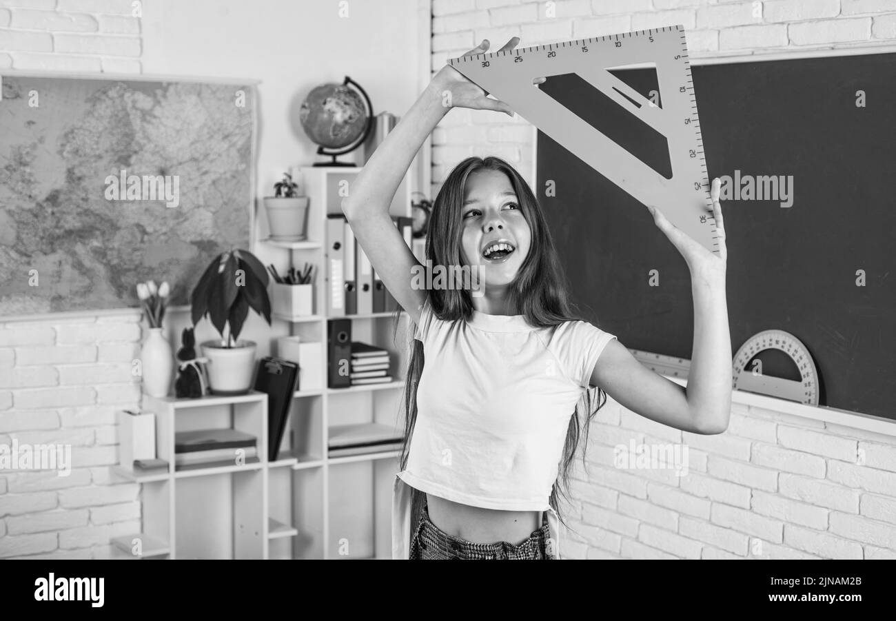 teen girl with triangle ruler. back to school. concept of education ...