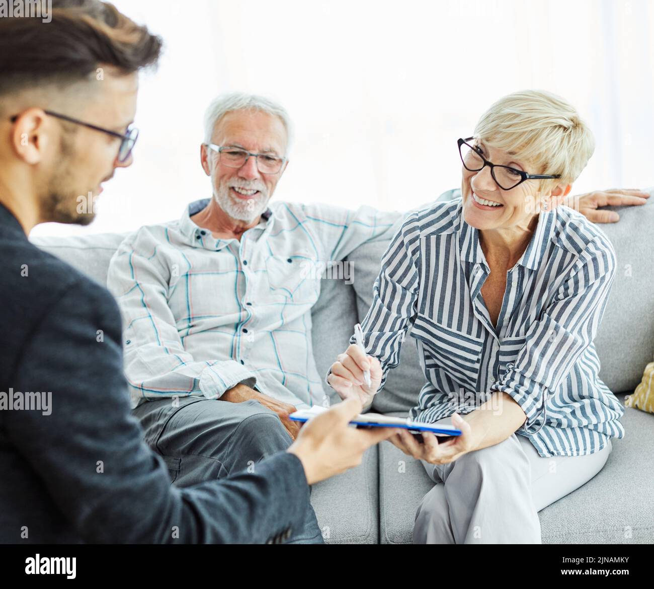 contract signing senior couple document investment business finance ...