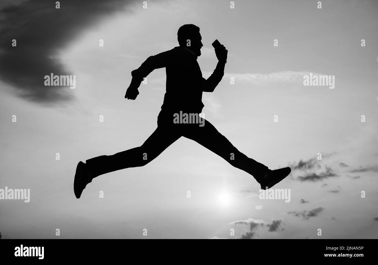 total freedom. personal achievement goal. man silhouette jump on sky ...