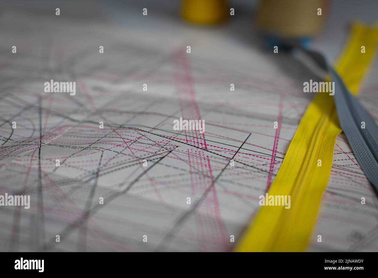 A paper die-cut sheet with various clothing patterns drawn on it Stock ...