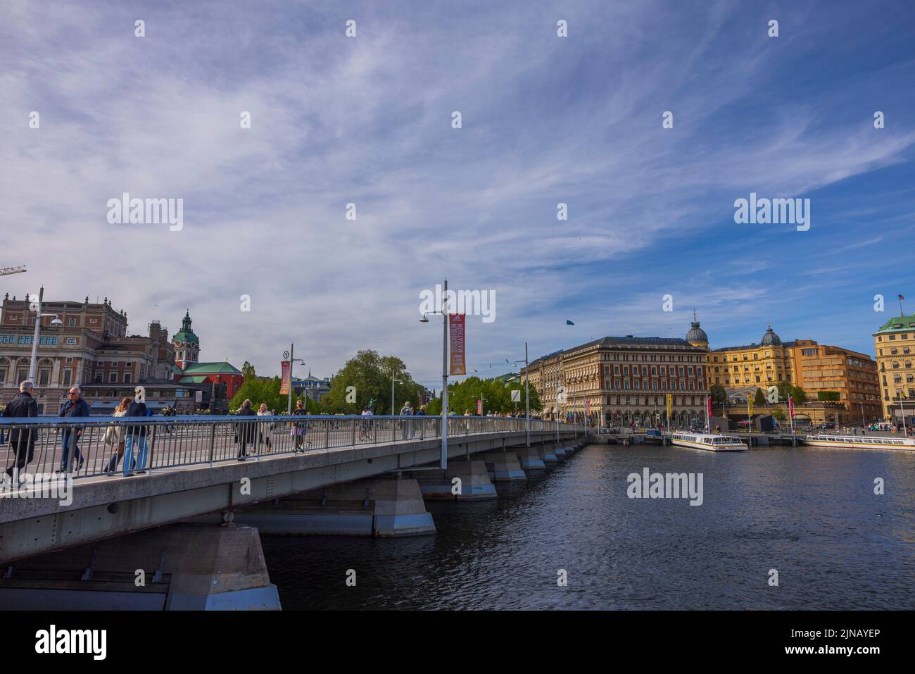 Beautiful Stockholm city landscape view. People walking on bridge over ...