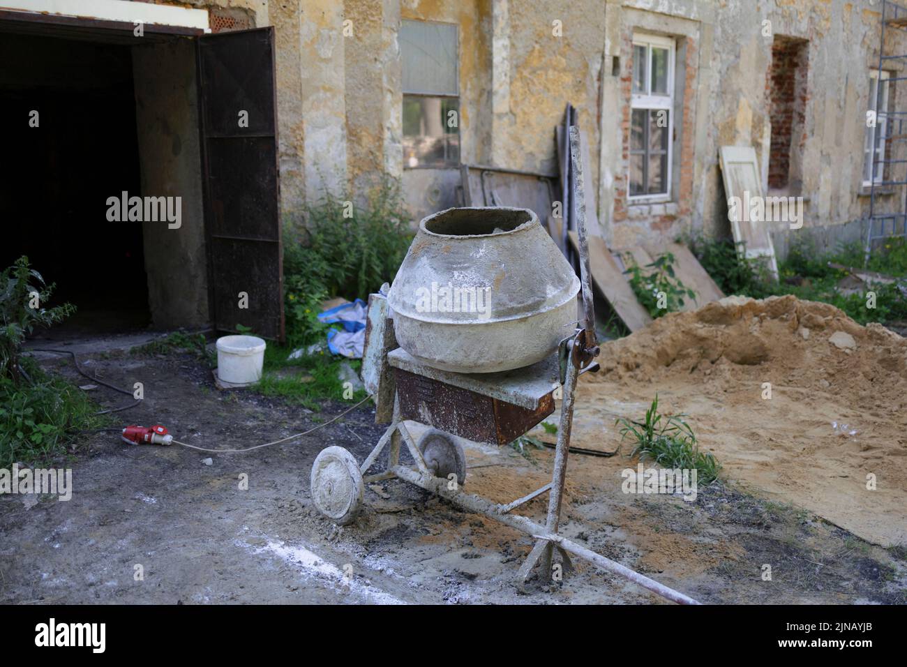 Cement mixer - tool and device is old, aged, tarnished, dirty, dingy ...