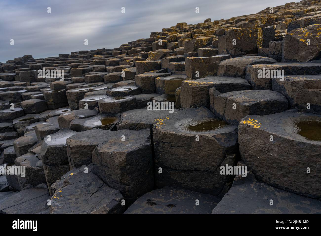A view of the many volcanic basalt columns of the Giant's Causeway in ...