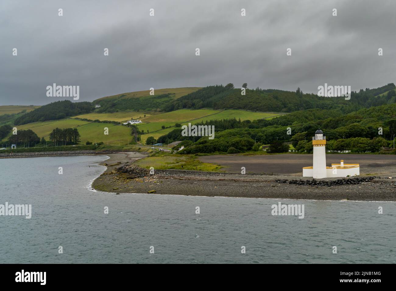A view of the lighthouse near the old harbor of Cairnryan on Loch Ryan ...