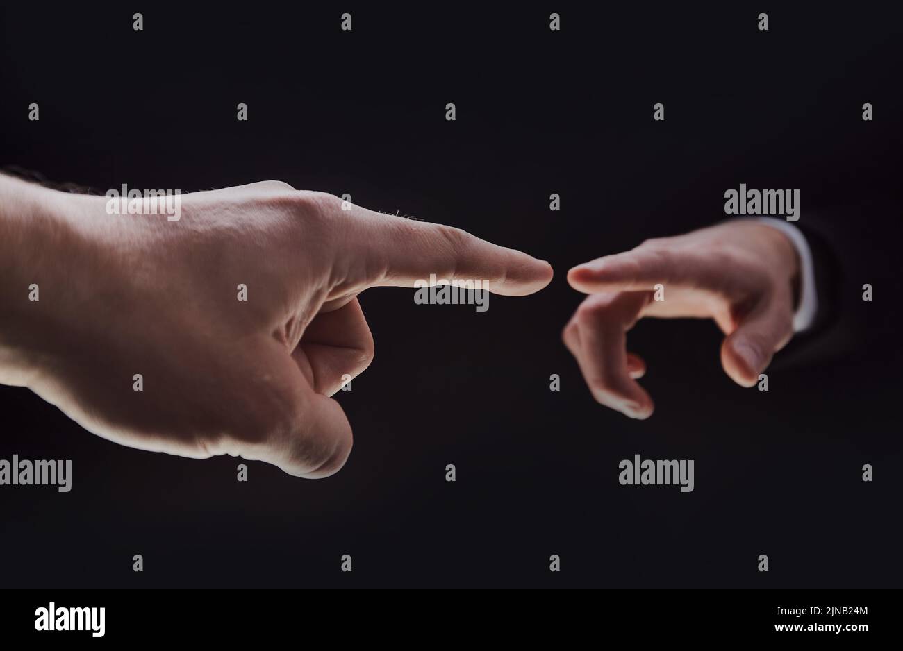 Hands isolated on black background with index finger extended Stock ...