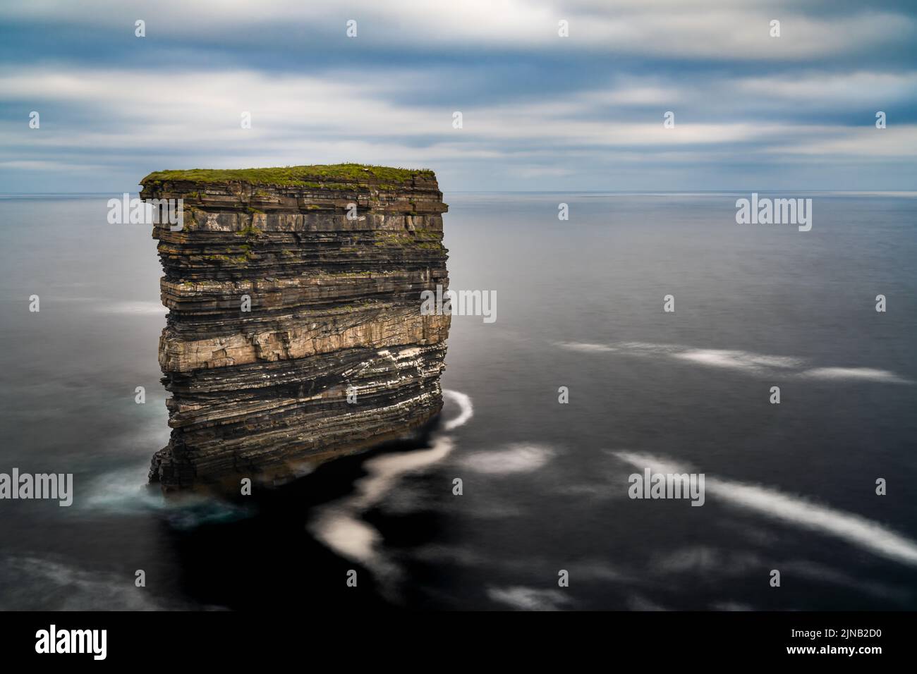 A long exposure view of the landmark sea stack Downpatrick Head in ...
