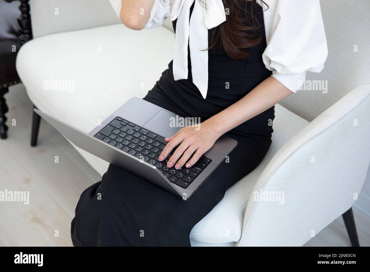 A Japanese woman typing laptop by remote work in the office faceless ...