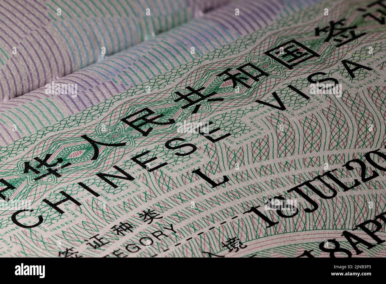 Chinese visa sticker in passport Stock Photo - Alamy