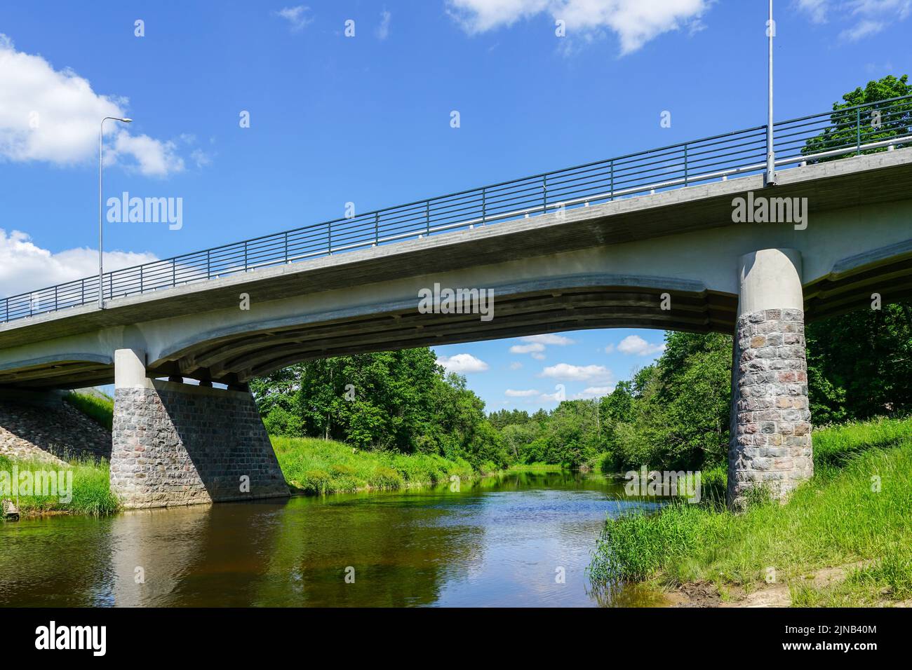 Beautiful stone and reinforced concrete bridge over the Abava River in ...