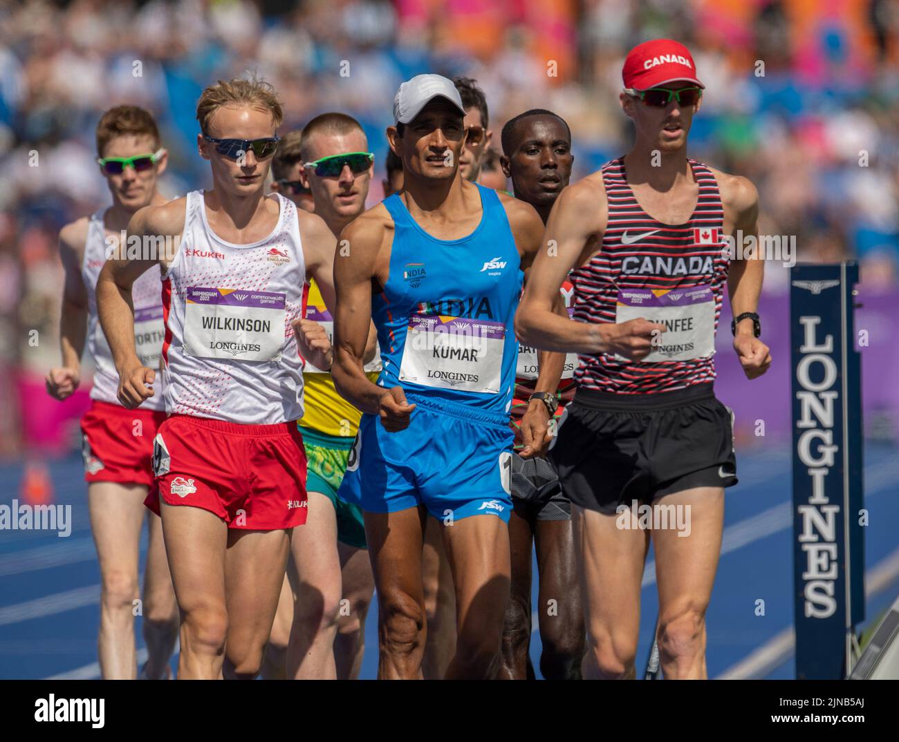 Callum Wilkinson of England, Sandeep Kumar of India and Evan Dunfee of ...