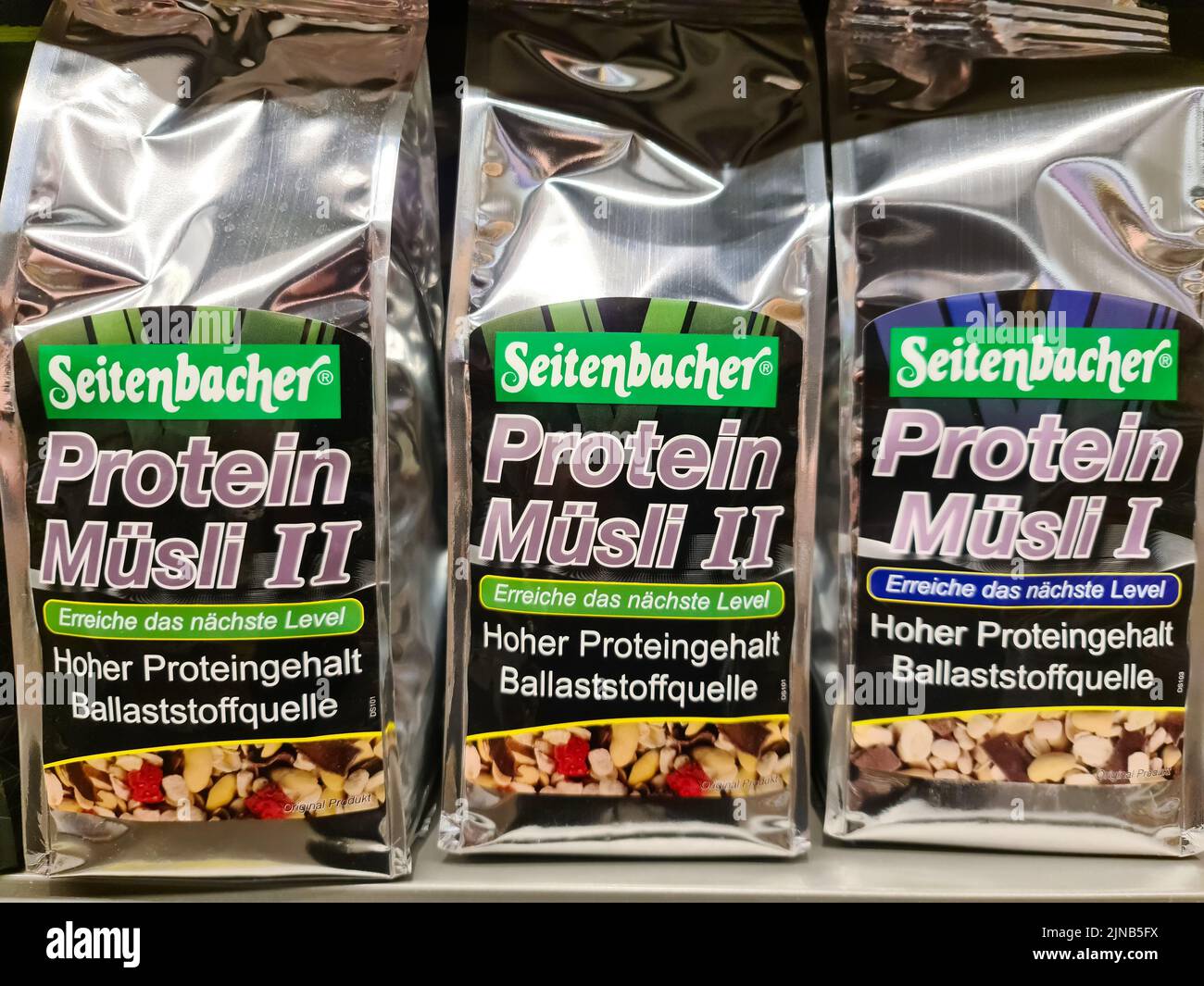 Three bags of Seitenbacher brand protein muesli on a supermarket shelf ...